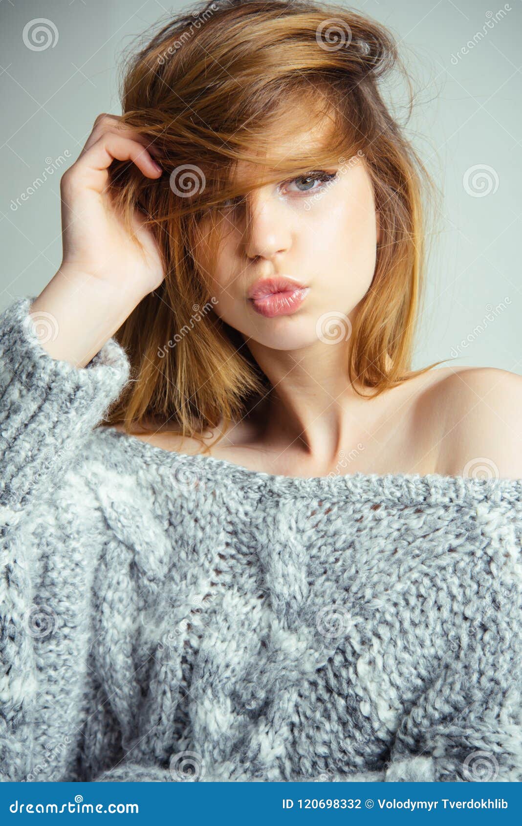 Fashion Portrait Woman Model Blowing Lips Sends Air Sweet Kiss On Grey