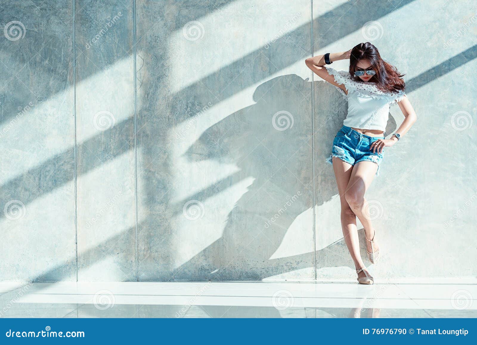 Fashion Portrait of Young Model Posing by the Wall Stock Photo - Image ...