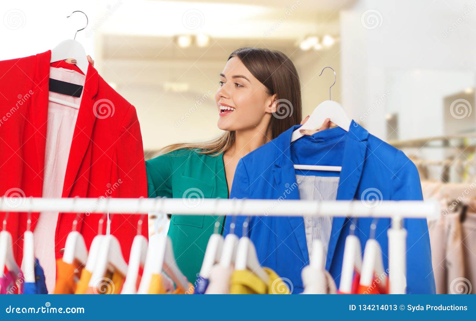 Happy Woman Choosing Clothes at Clothing Store Stock Image - Image of ... Happy Woman Choosing Clothes at Clothing Store Stock Image - Image of ...
