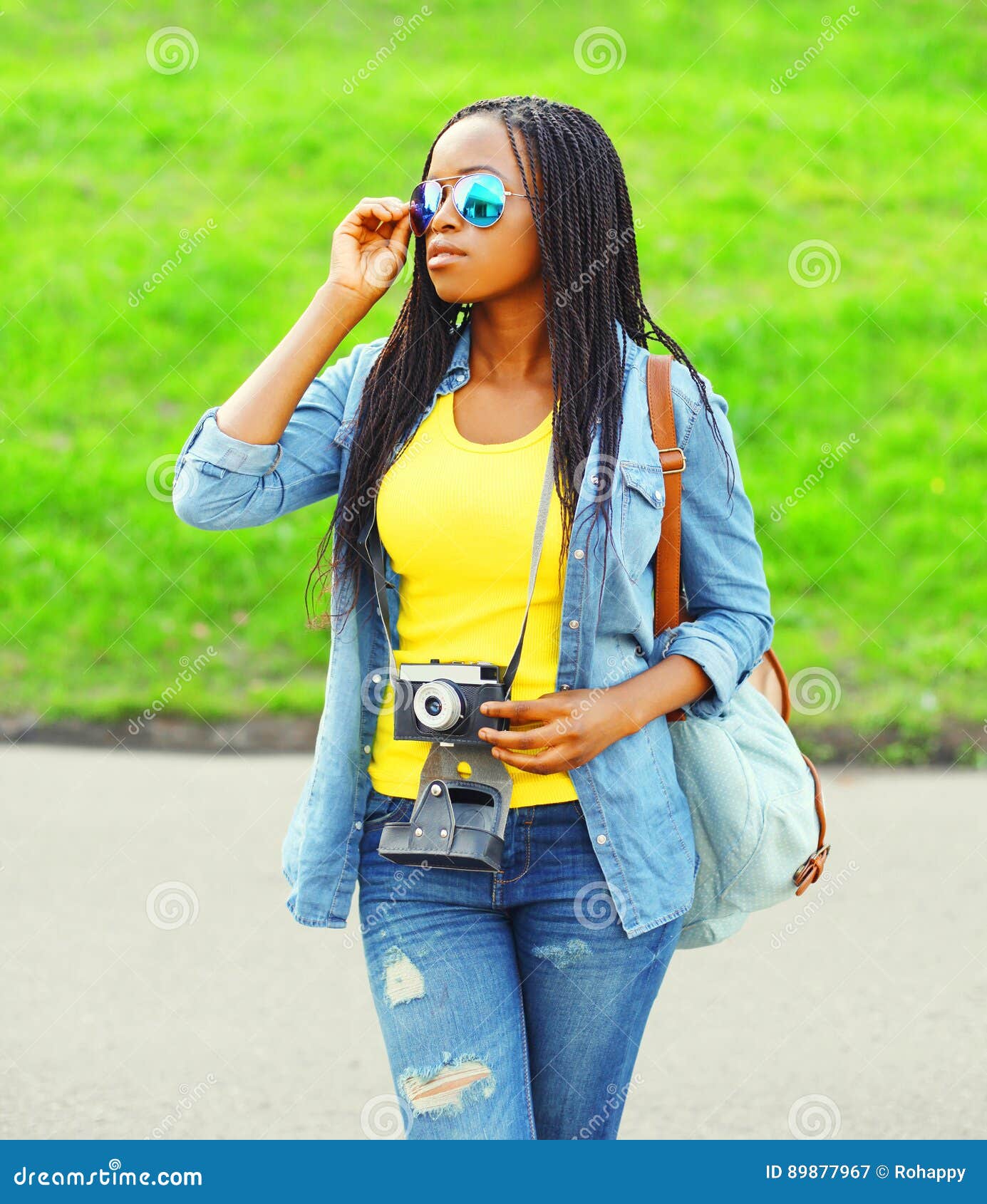 Fashion Young African Woman Holds Retro Vintage Camera Wearing A Jeans