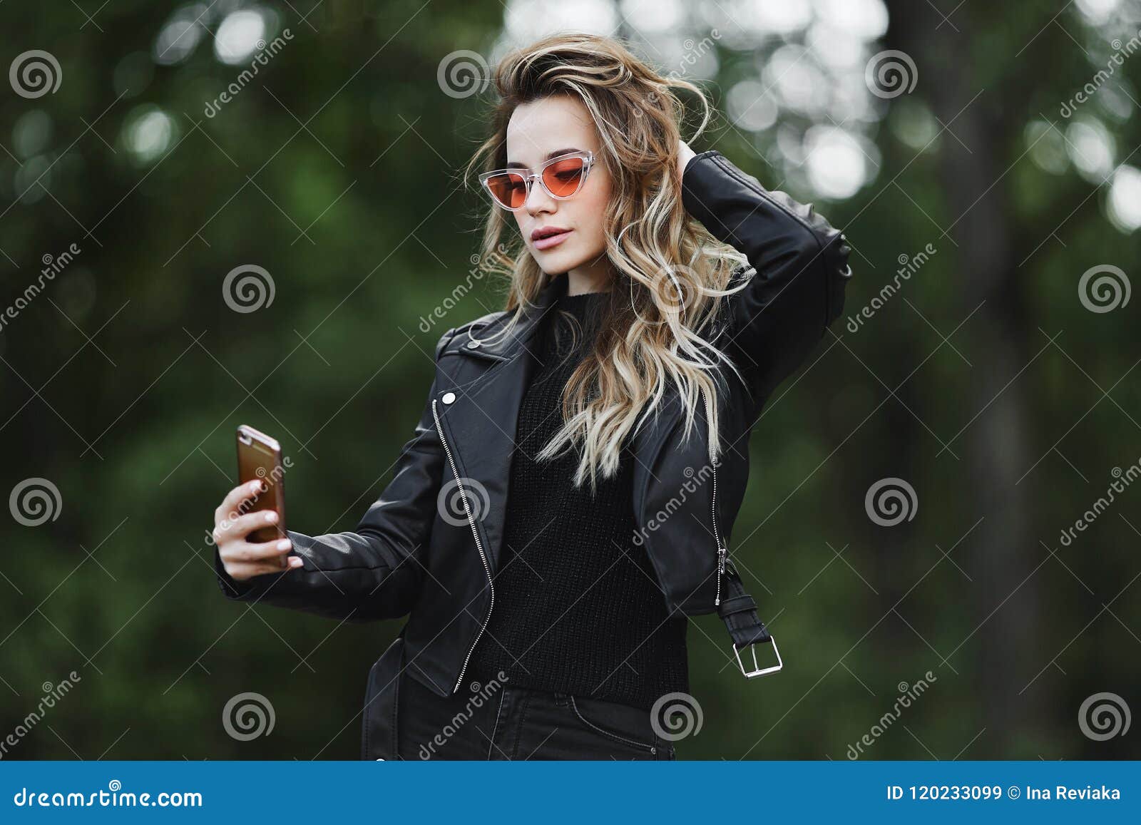 Fashionable Beautiful And Sensual Blonde Model Girl In Black Leather