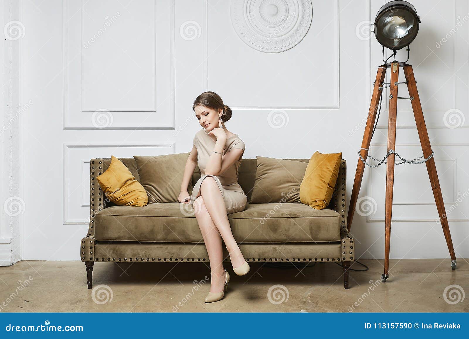 Fashionable And Beautiful Young Brunette Model Woman In Beige Dress