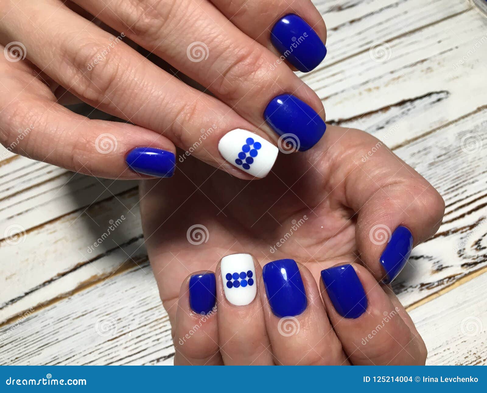 Fashionable blue manicure stock photo. Image of polish - 125214004