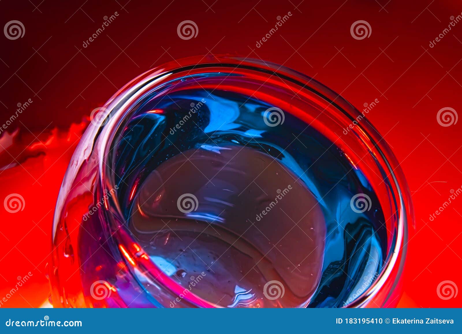 Fashionable Double Bottom Cup with Blue Liquid on Red Backround ...