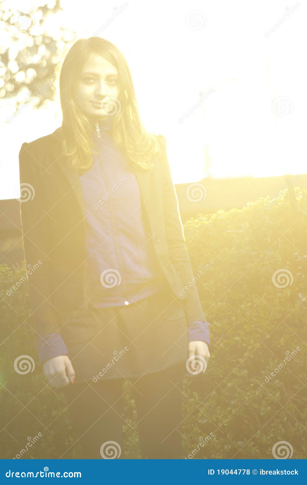 Fashionable Female in 20s Backlit by the Sun Stock Photo - Image of ...