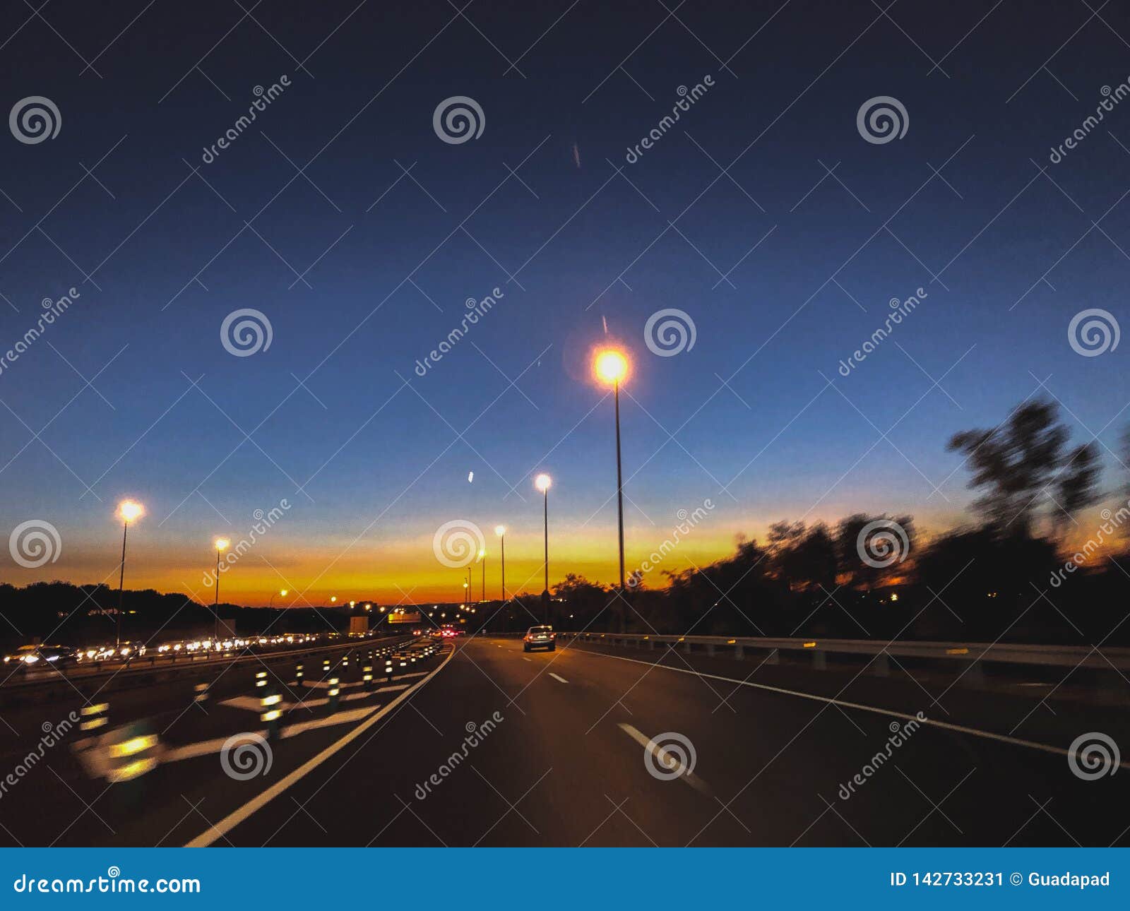 Fast car on the highway . stock image. Image of sunset - 142733231