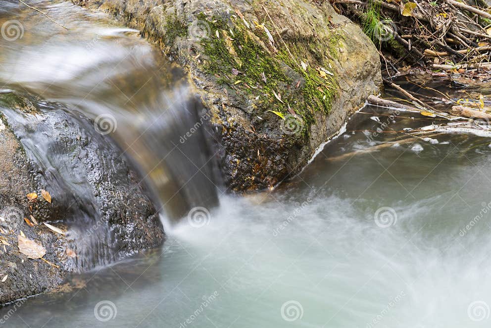 Fast Flow of Water in a Small Waterfall Stock Image - Image of ...
