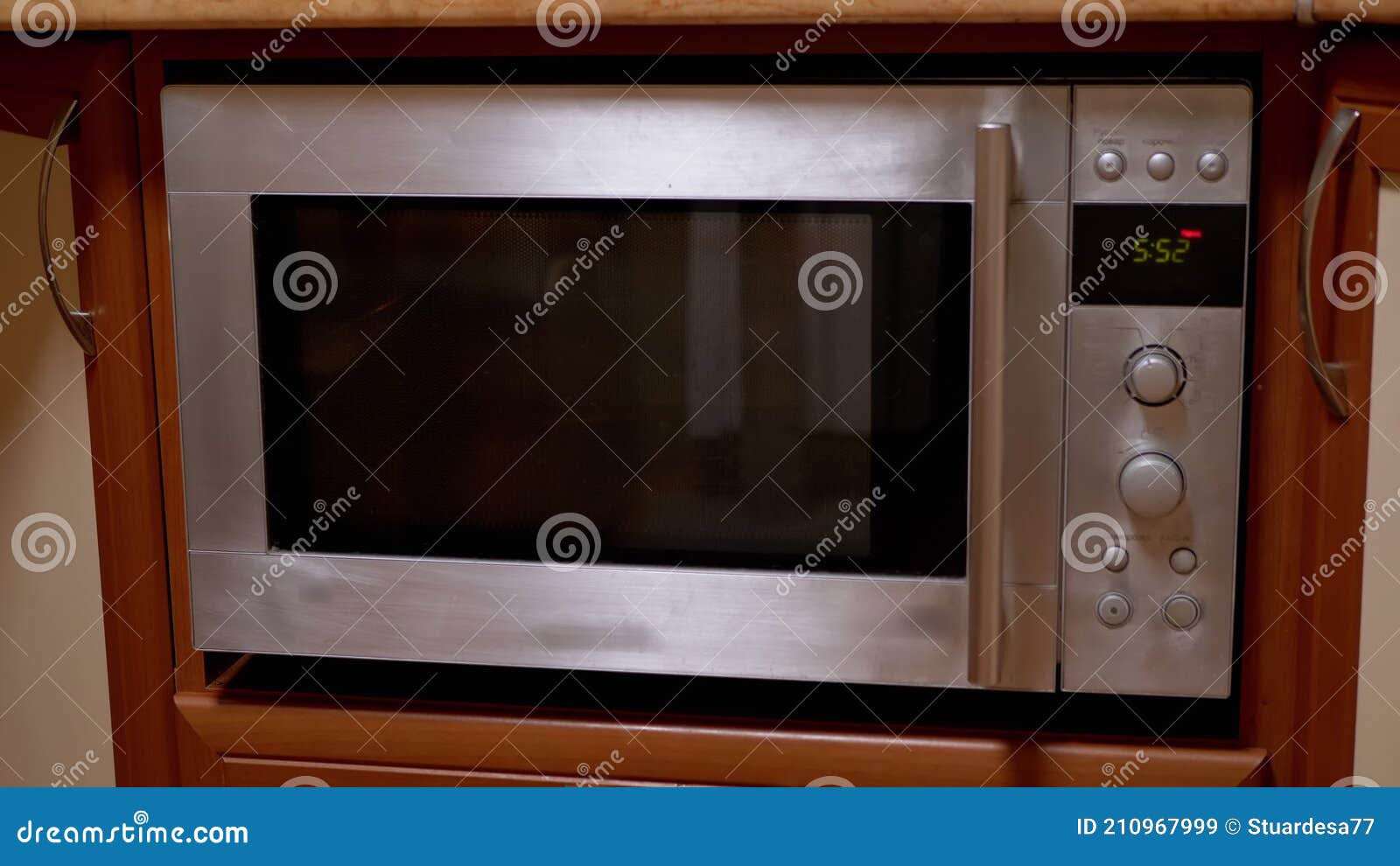 Fast Microwave Countdown on Microwave Oven Panel. Time 5 Minutes 57 ...