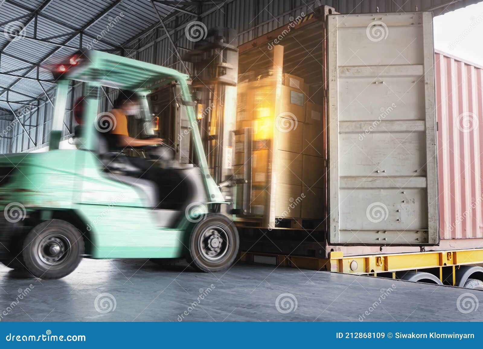 Fast Motion Blur of Forklift Driver Loading Shipment Boxes into Cargo ...