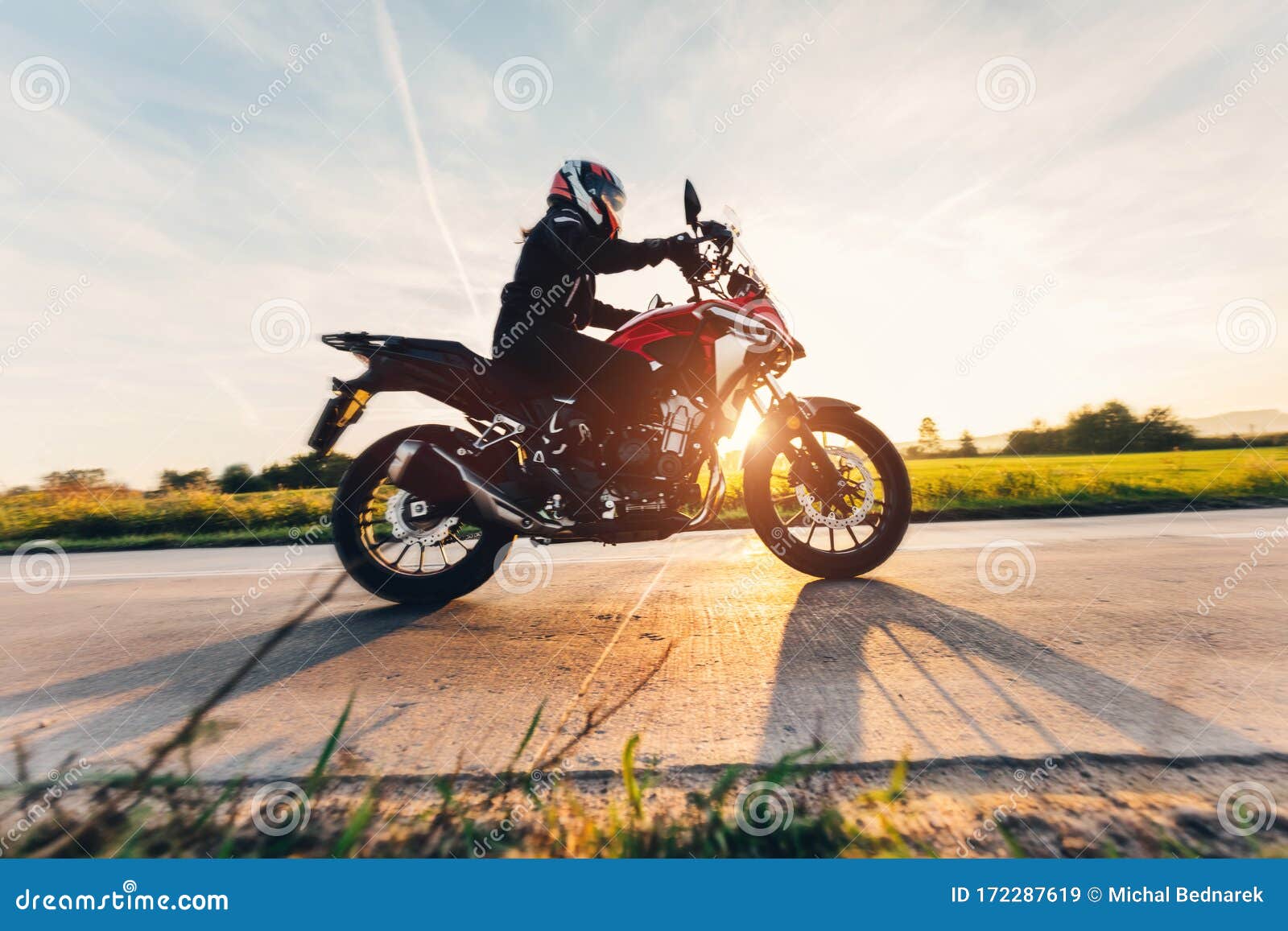 Fast Motorcycle Drive on Asphalt Road at Sunset. Stock Image - Image of ...