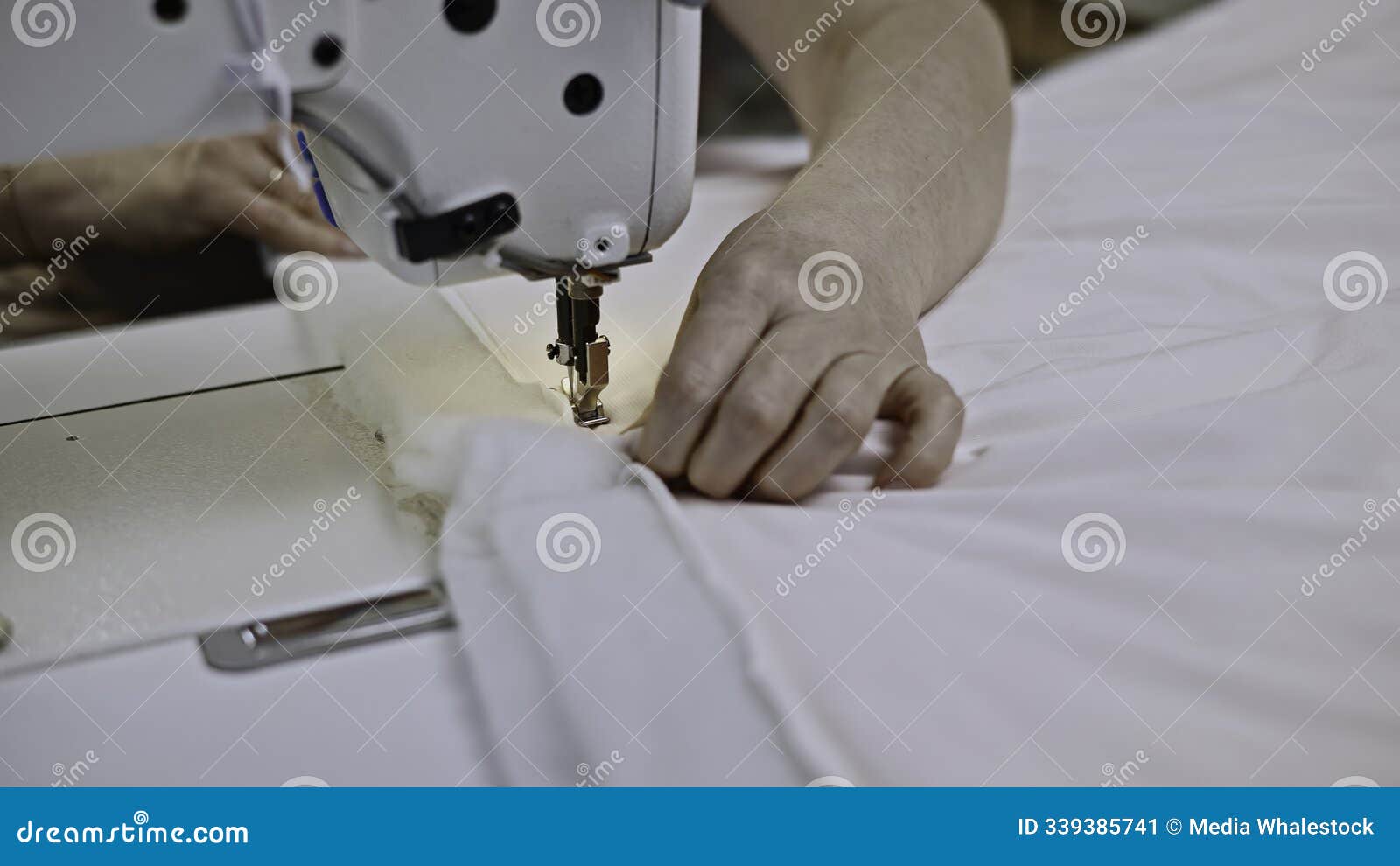Fast Movement of the Sewing Machine Needle on the White Fabric. Media ...
