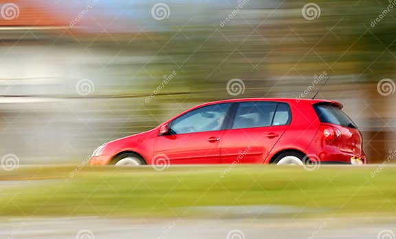 Fast moving red car stock photo. Image of camera, joyride - 2511276