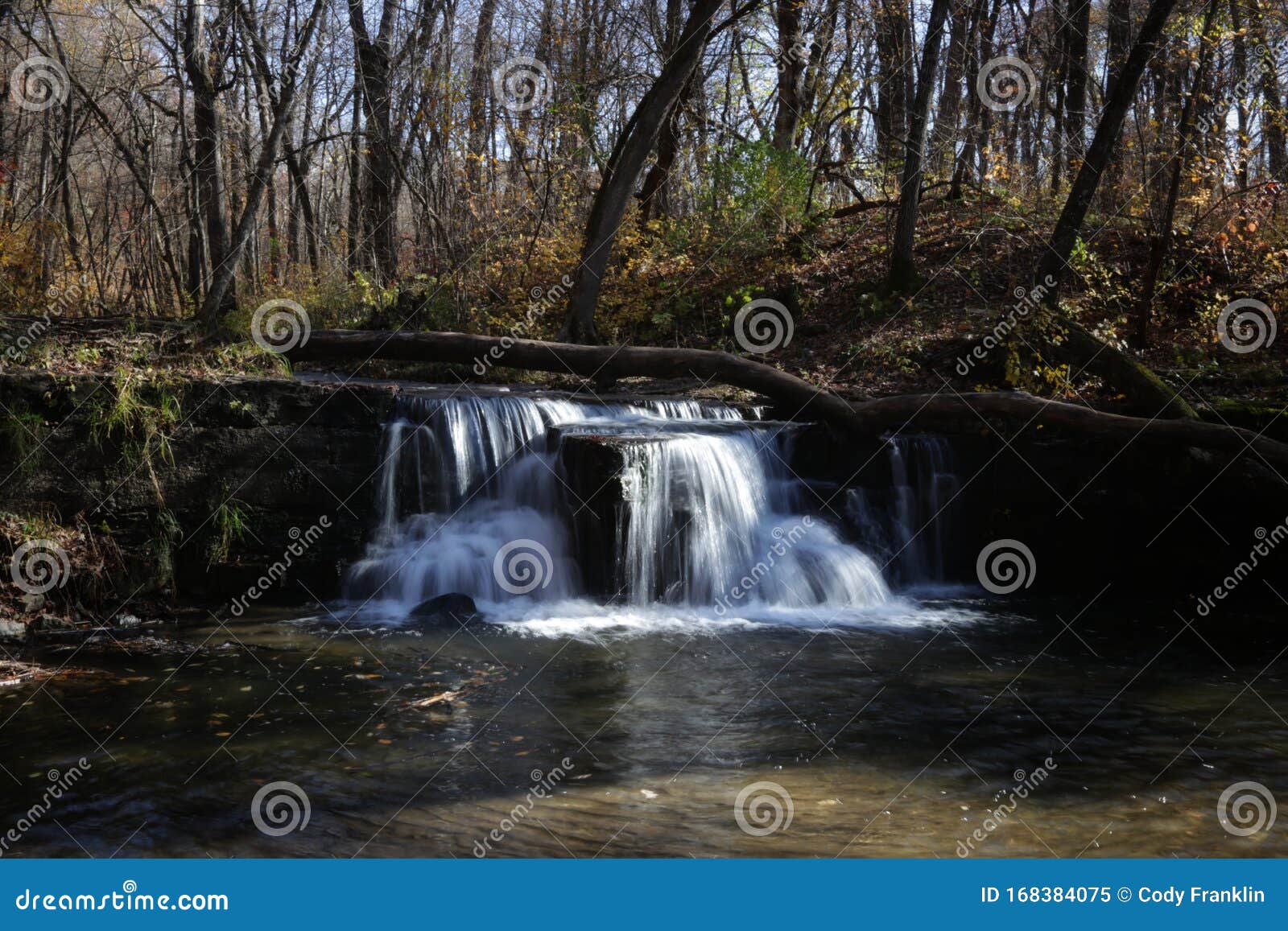 A fast moving waterfall stock image. Image of nature - 168384075