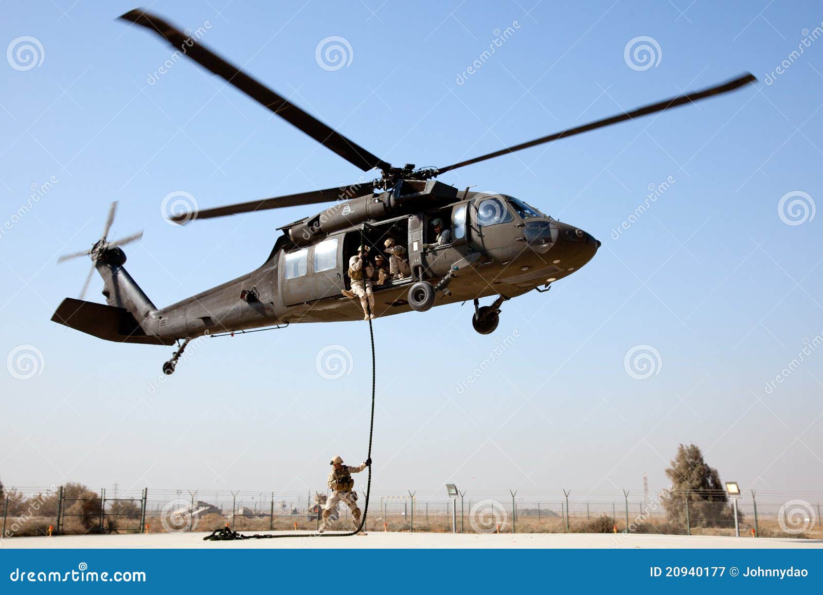 Fast rope from a Blackhawk editorial photography. Image of exercise ...