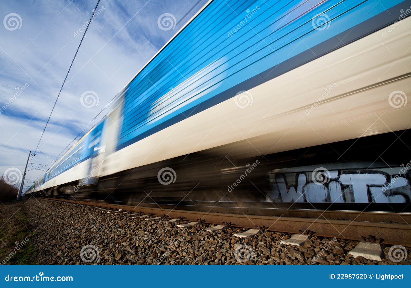 Fast Train Passing Under a Bridge on a Lovely Summer Day Stock Photo ...