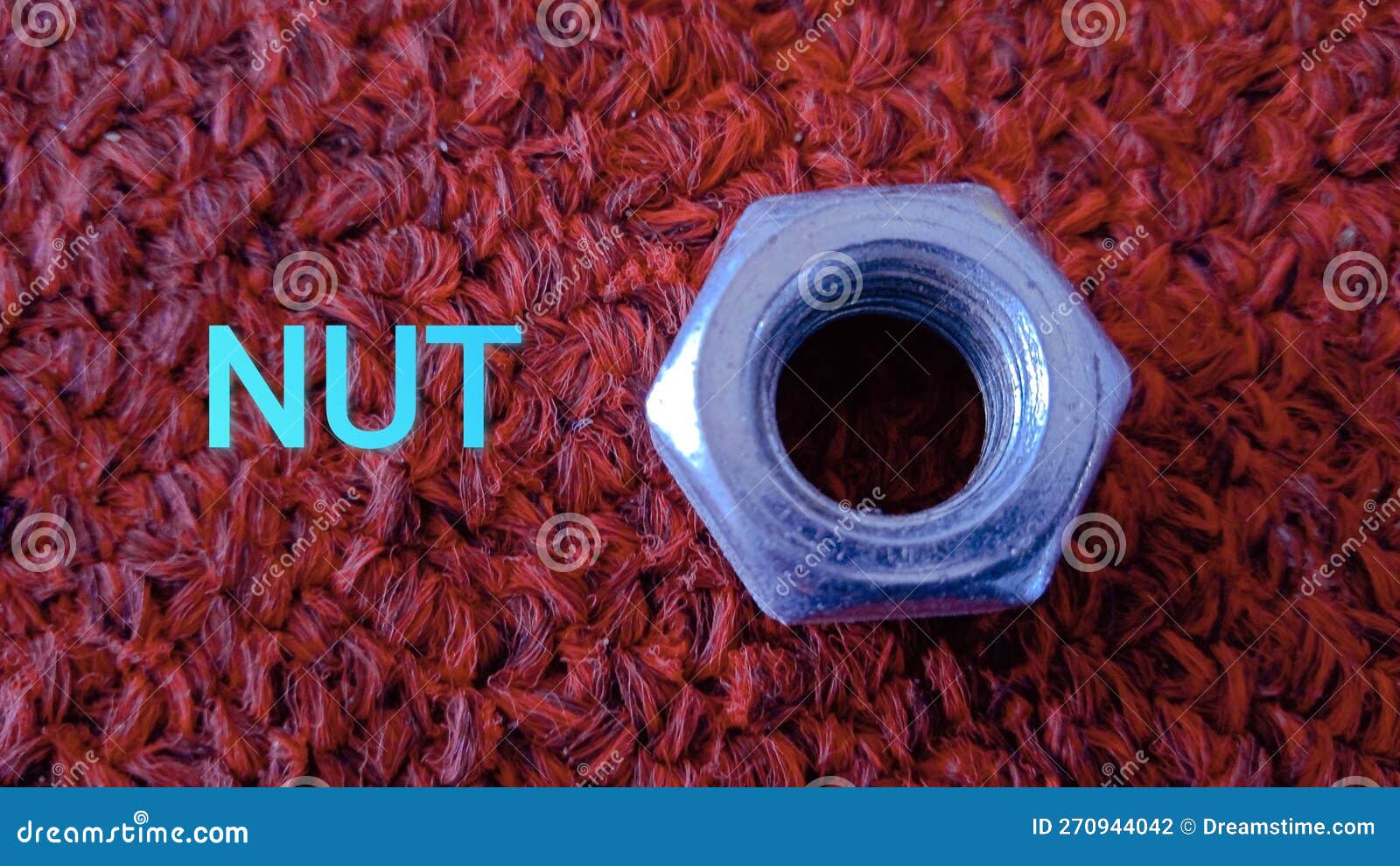 Fastener nut on red mat stock photo. Image of pattern - 270944042