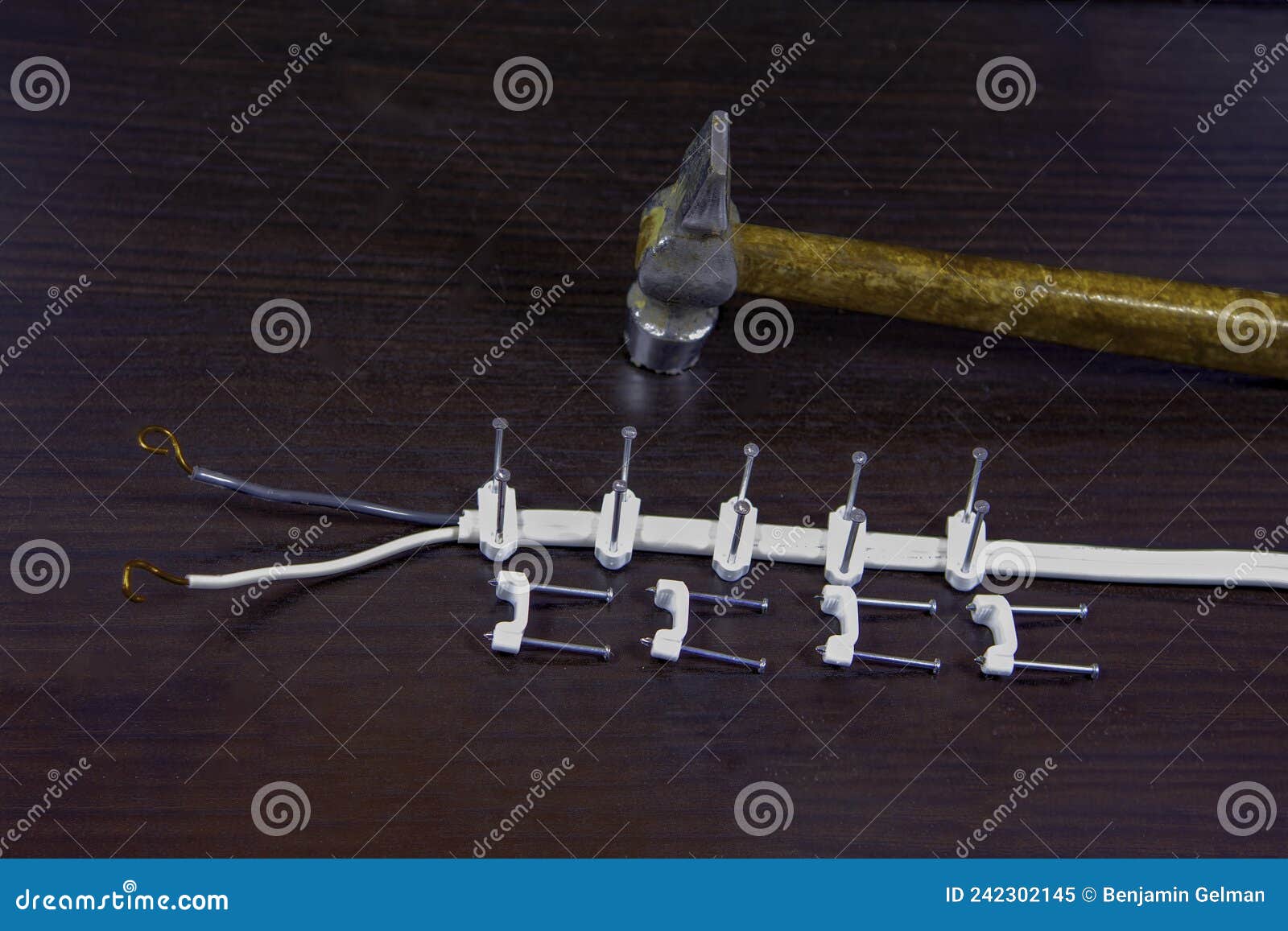 Fastening Clips for Electrical Wires and a Hammer Stock Image - Image ...
