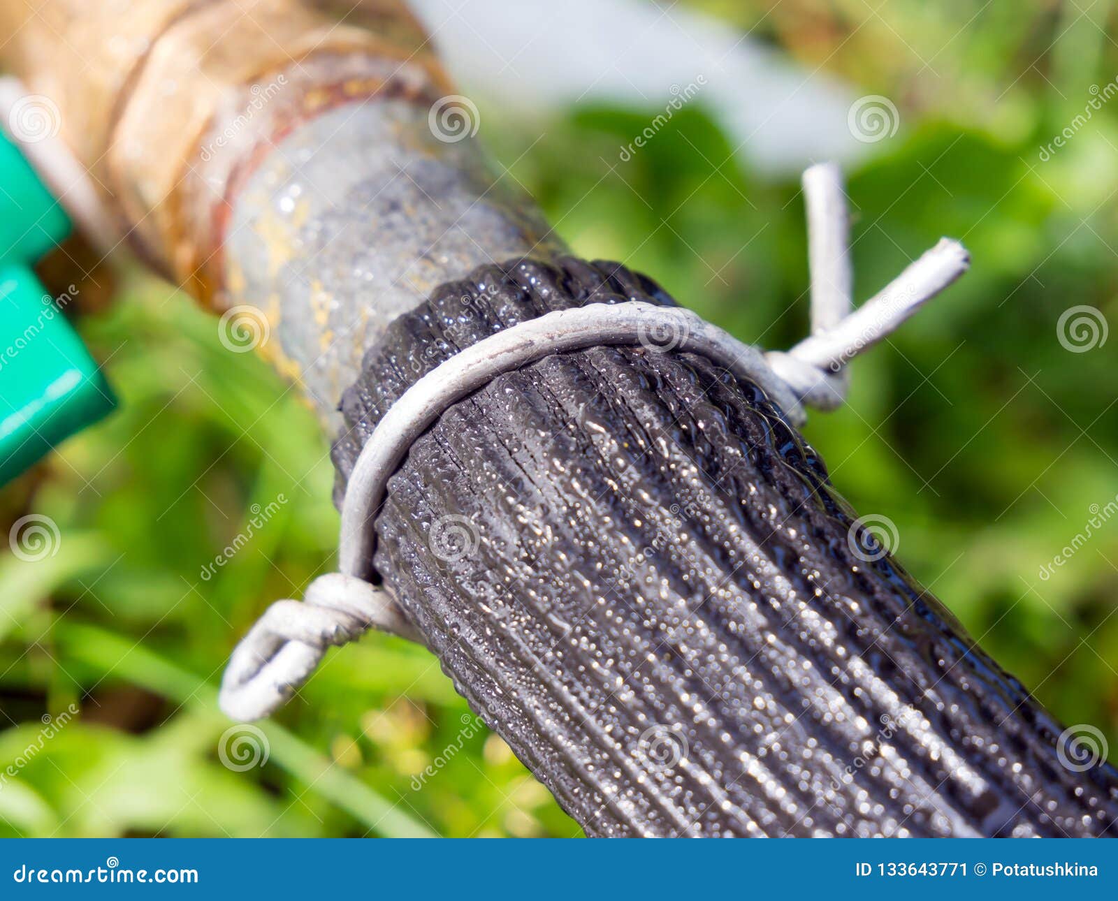 Fastening the Hose To the Pipe with a Wire Clamp Stock Image - Image of ...