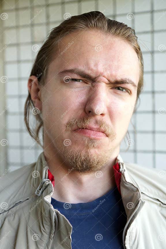 Fastidious young man stock image. Image of people, head - 27496127