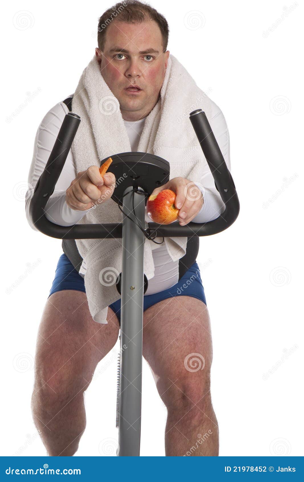 Fat guy on bike stock photo. Image of stationary, apple - 21978452