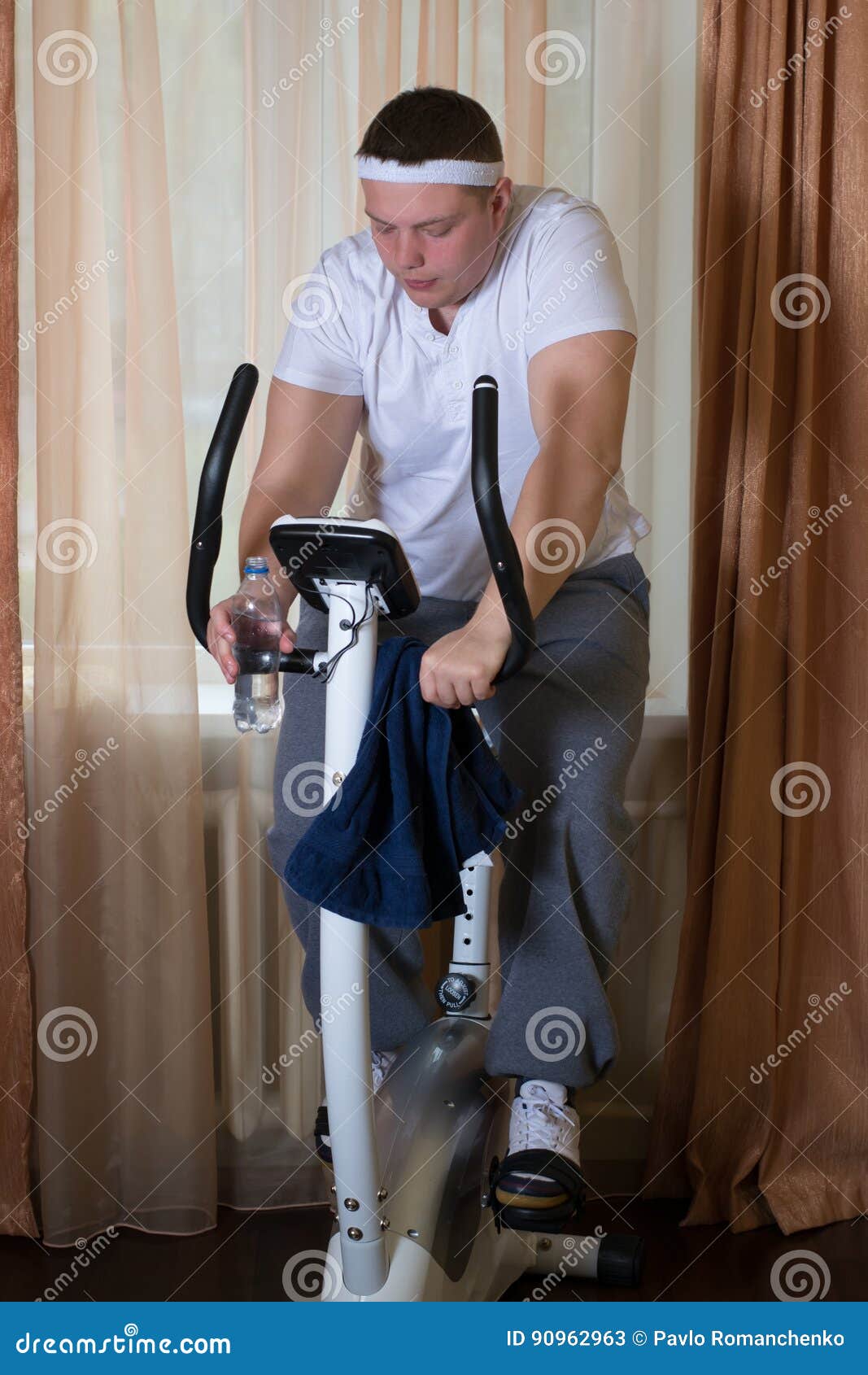 Fat Guy Exercising on Stationary Training Bicycle Stock Image - Image ...