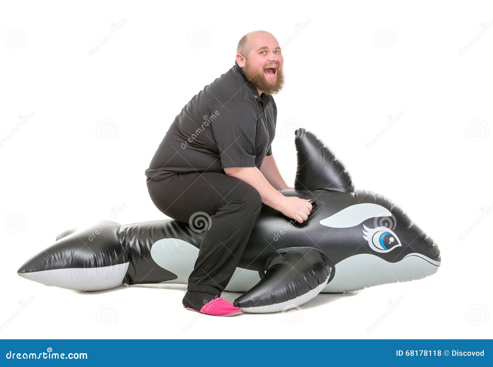 Fat Man Fun Jumping on an Inflatable Dolphin Stock Photo - Image of ...