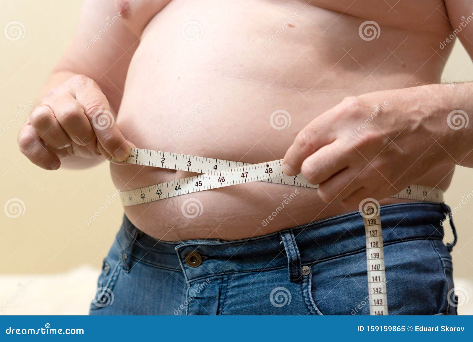Fat Man in Jeans Measures the Waist Stock Image - Image of build, pants ...