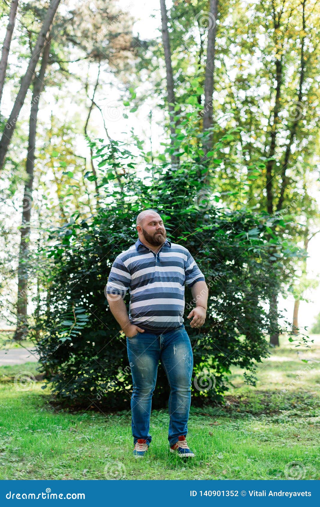 Fat Man in the Park Looks into the Frame, a Portrait of a Man with ...