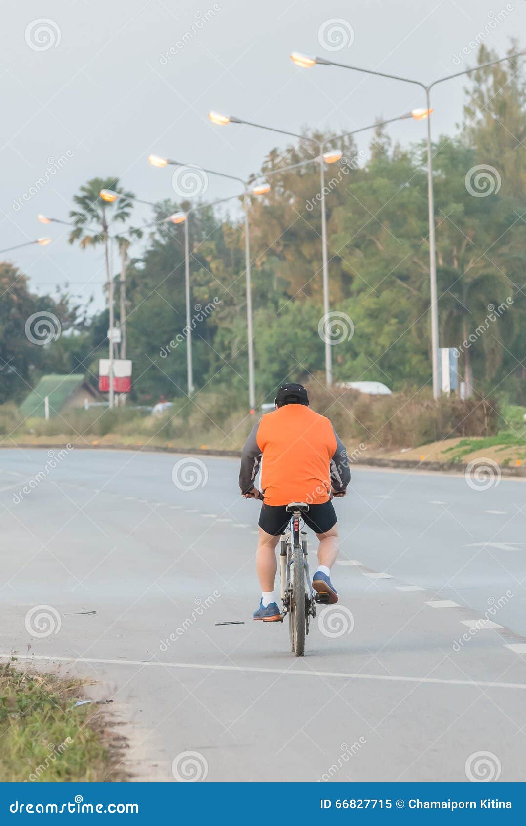 Fat Man Riding a Bicycle stock image. Image of cyclist - 66827715
