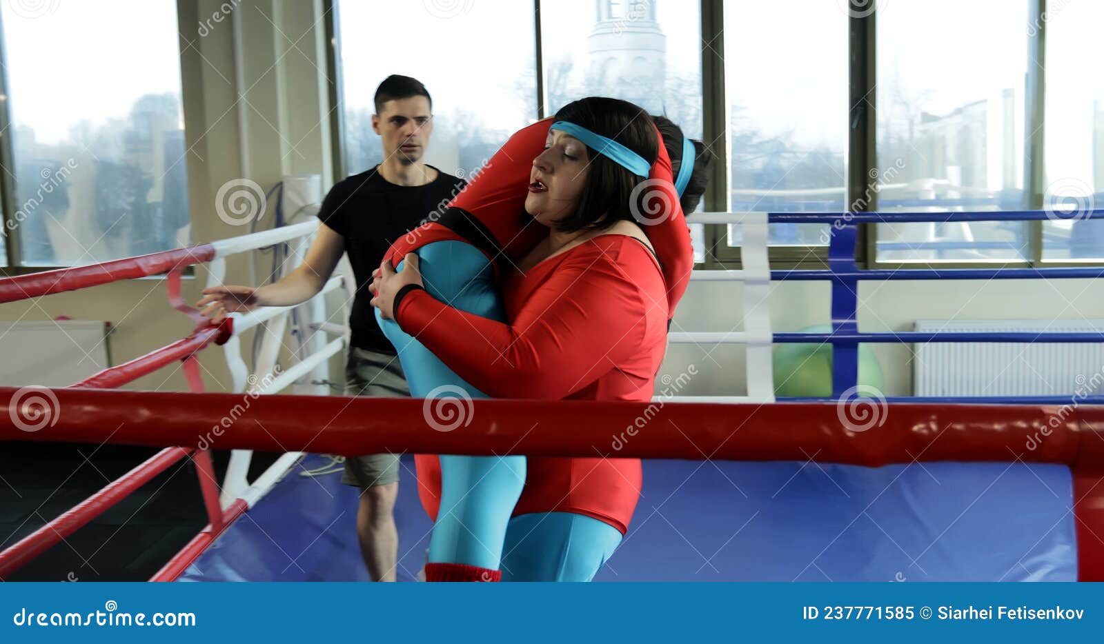 Fat and Thin Women Train in the Boxing Ring with a Trainer. Stock Image ...