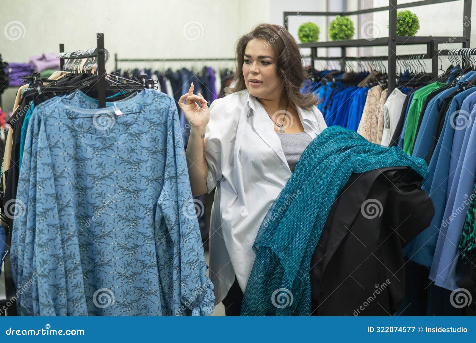 A Fat Woman Chooses Clothes in a Plus Size Store. Stock Image - Image ...