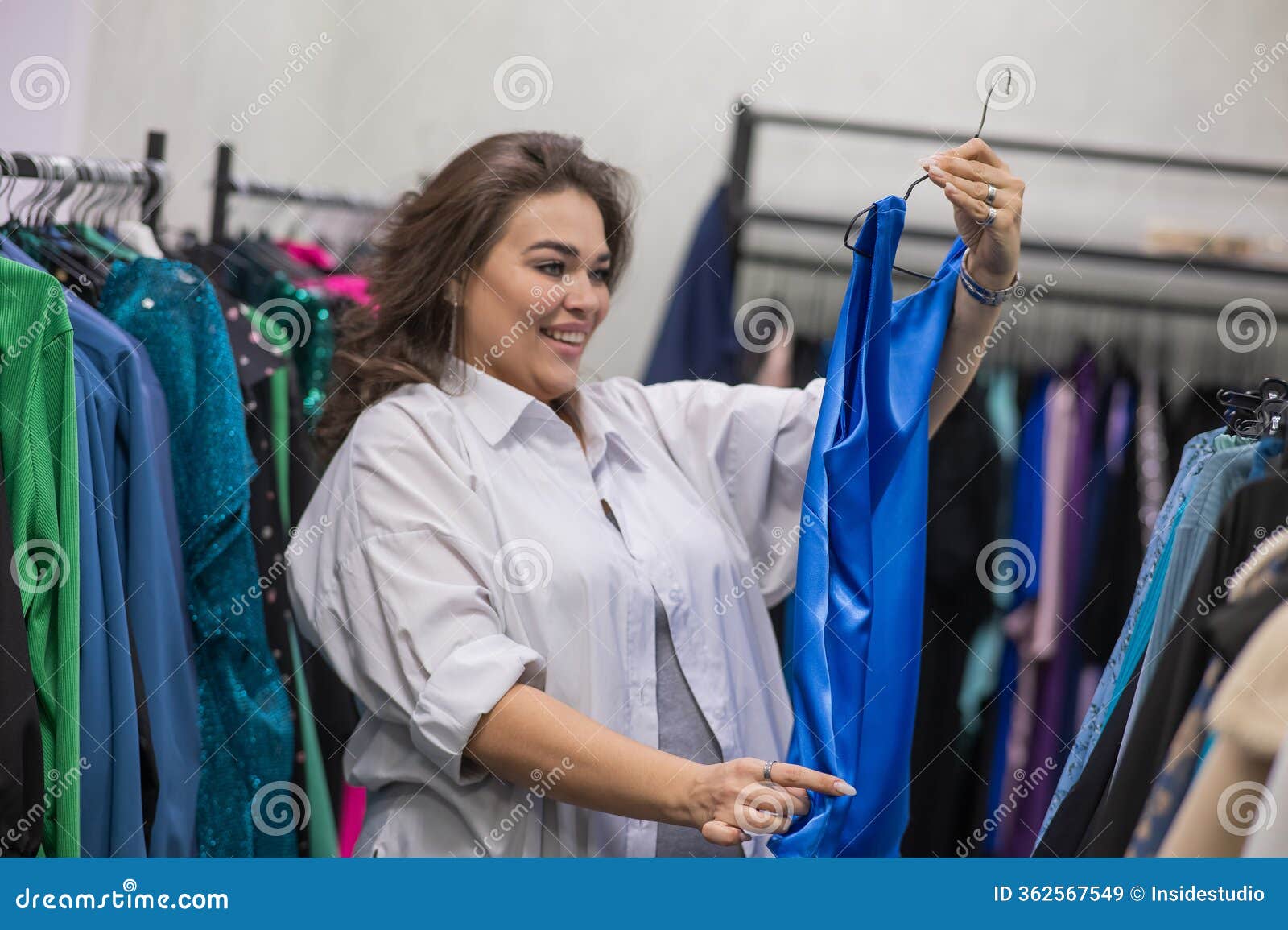 A Fat Woman Chooses Clothes in a Plus Size Store. Stock Image - Image ...