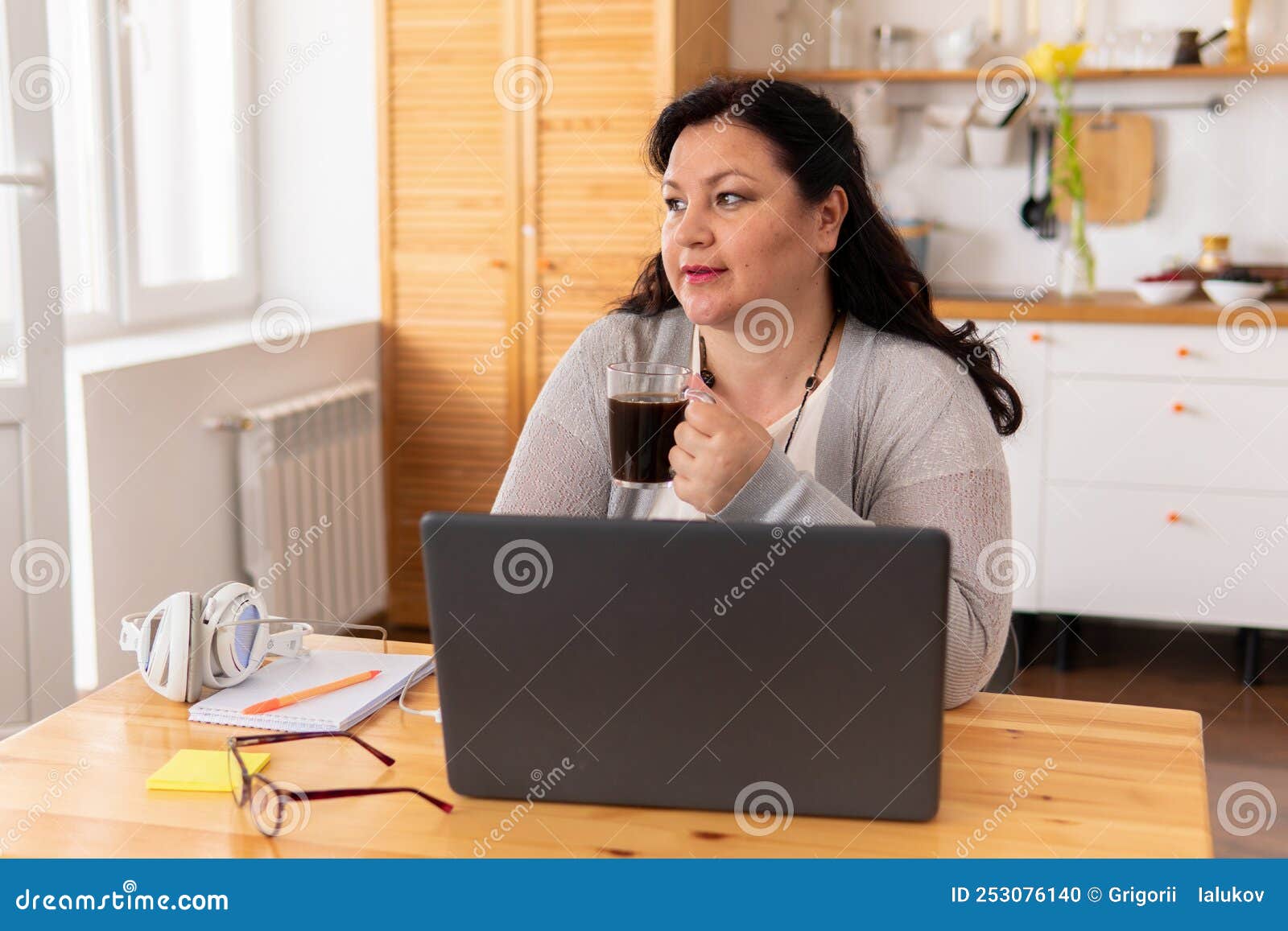 A Fat Woman is Sitting at a Table with a Laptop. Stock Photo - Image of ...