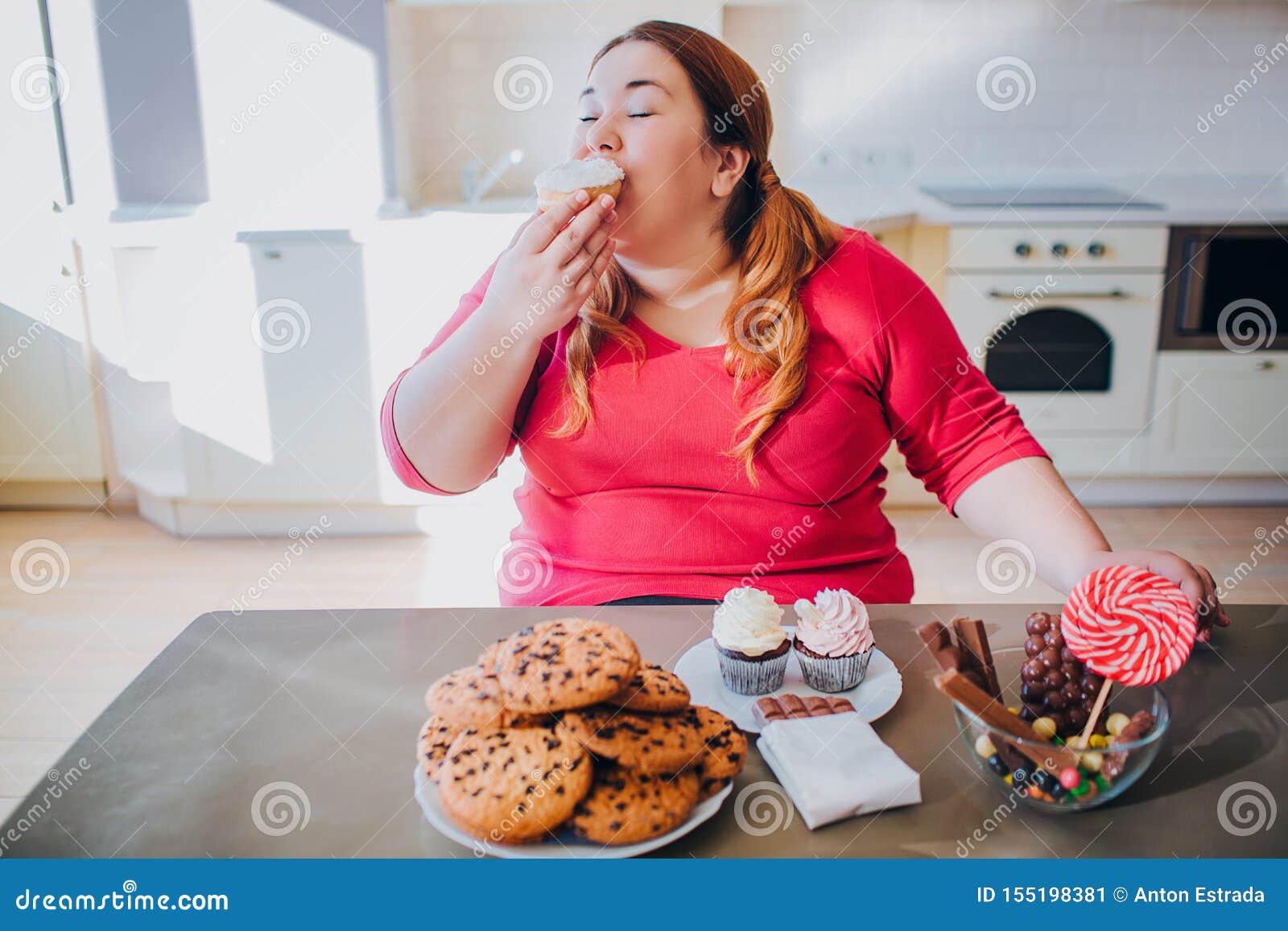 Fat Young Woman In Kitchen Sitting And Eating Sweet Food Gluttony Fat