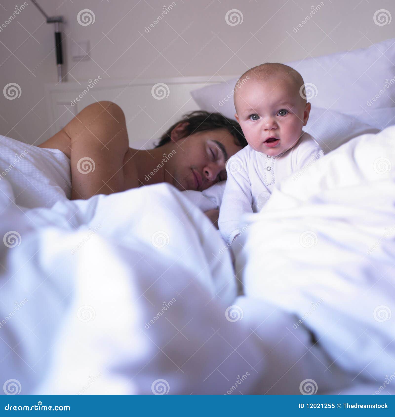 Father and Baby in Bed stock image. Image of innocence - 12021255