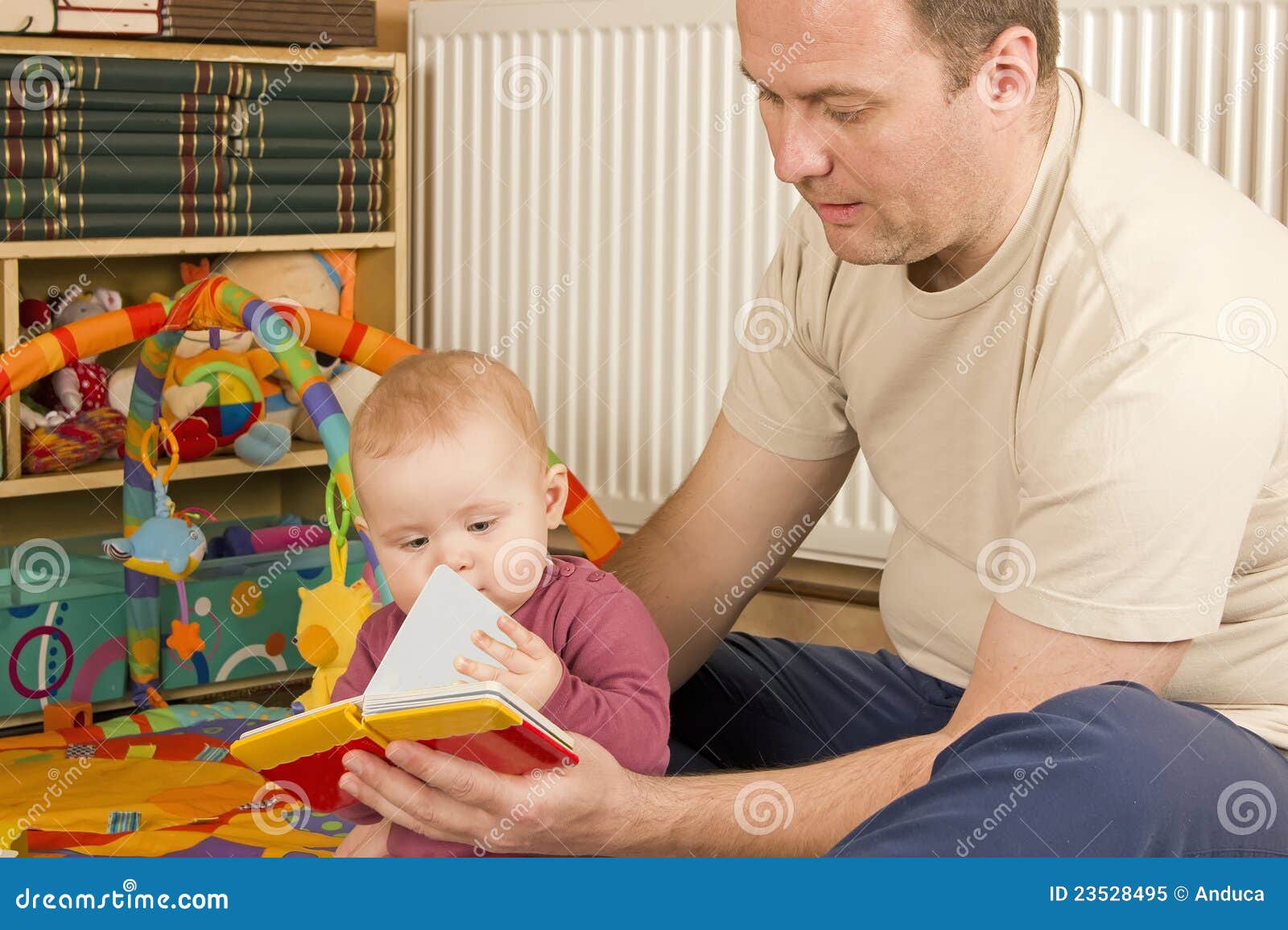 Father, baby and a book stock image. Image of drawing - 23528495