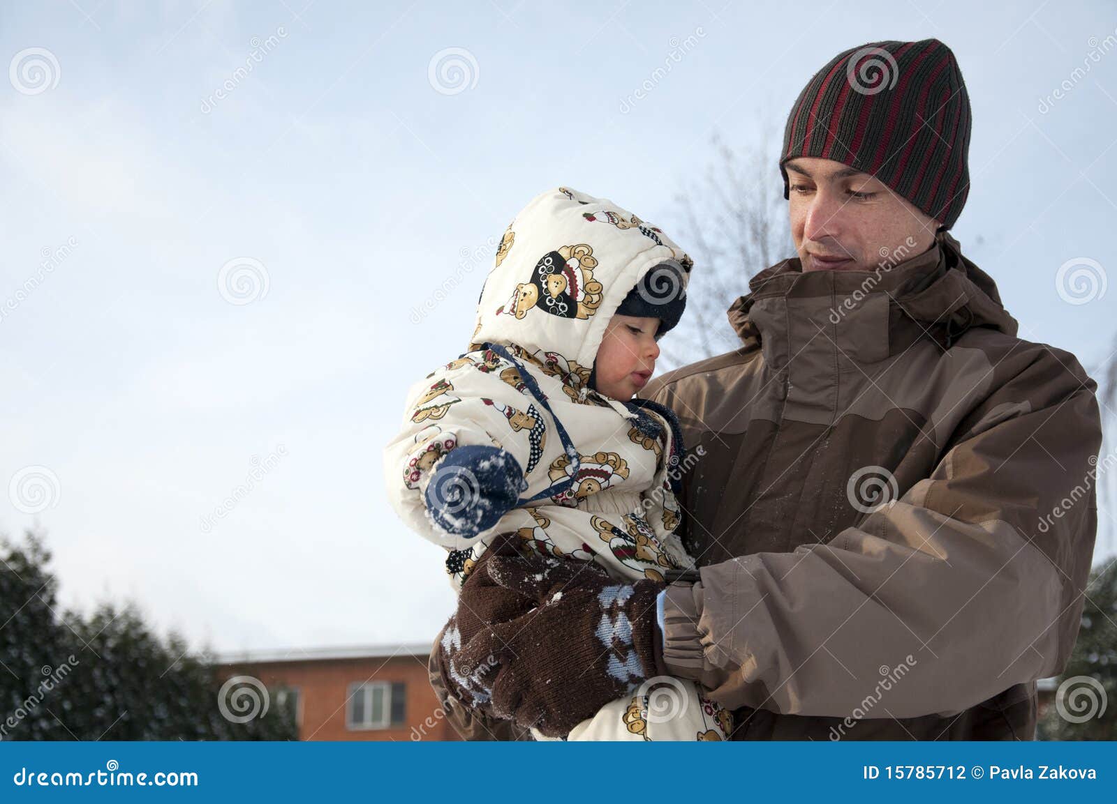 Father and baby in snow stock photo. Image of carry, houses - 15785712