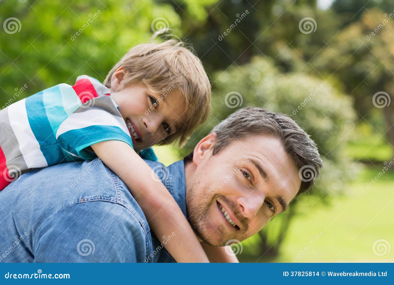 Father Carrying Young Boy on Back at Park Stock Photo - Image of casual ...