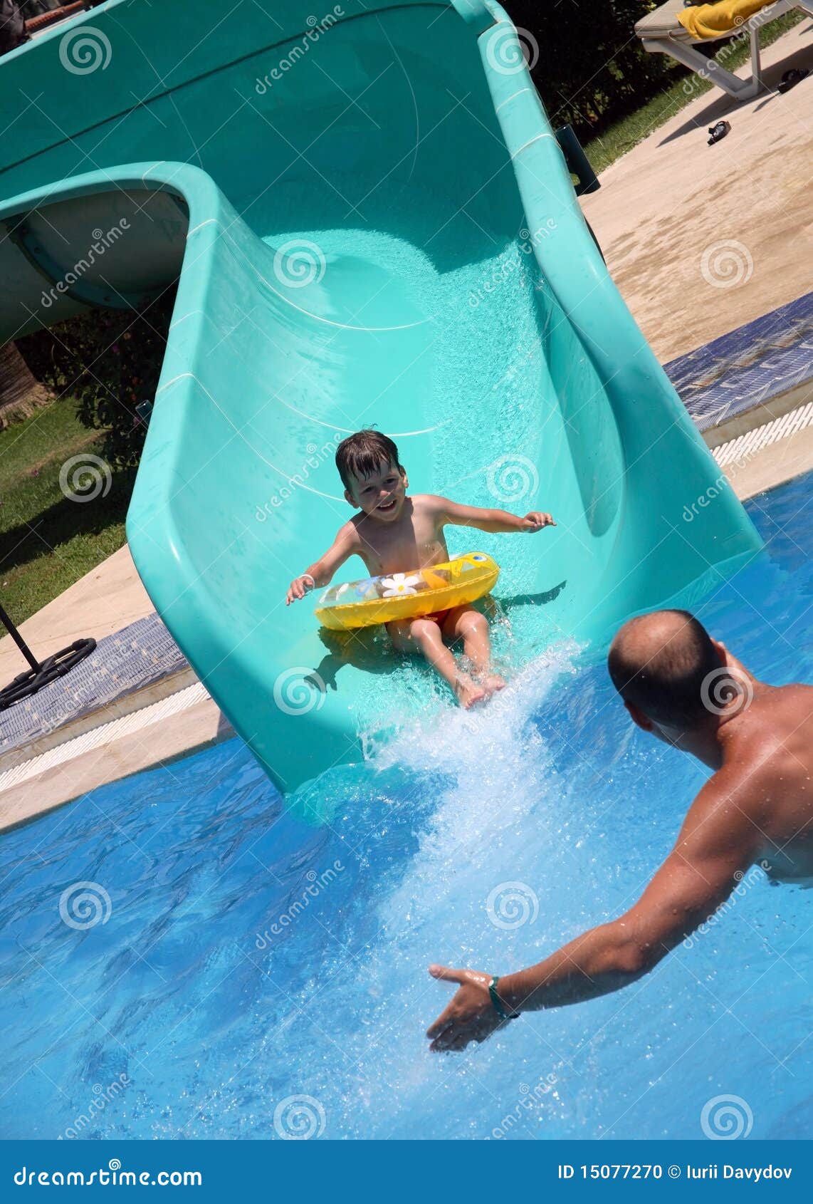 Father Catches Child on Water Slide Stock Photo - Image of father, park ...