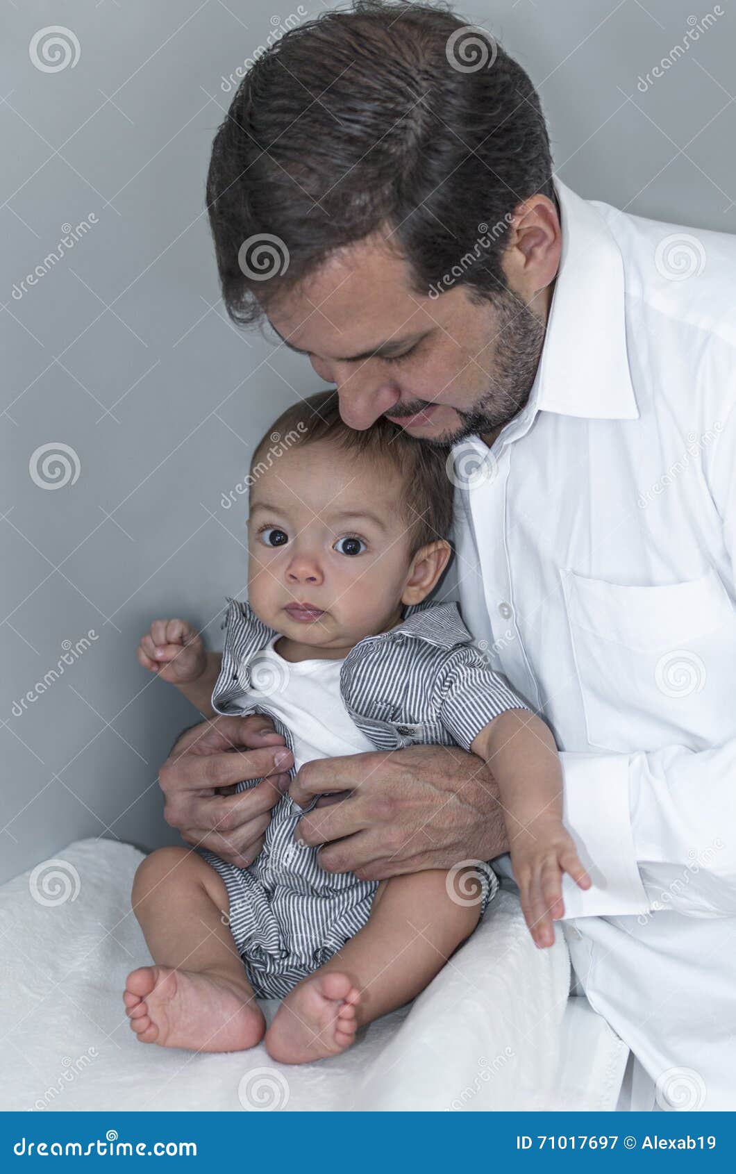 Father Changing and Dressing Up Baby Stock Image - Image of hold ...
