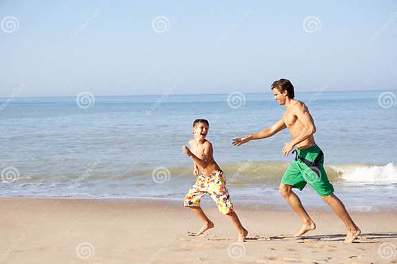 Father Chasing Young Boy on Beach Stock Image - Image of together ...