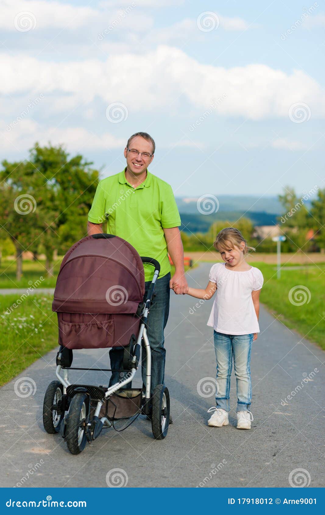 Father with Child and Baby Buggy Stock Photo - Image of baby, path ...