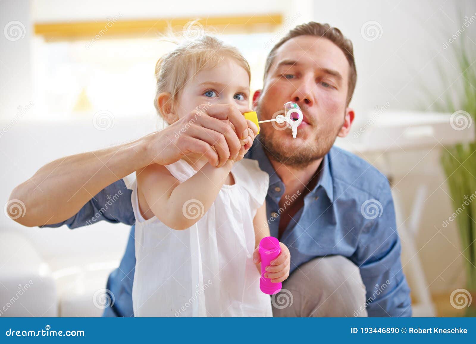 Father and Child Blow Bubbles Together Stock Photo - Image of joyful ...