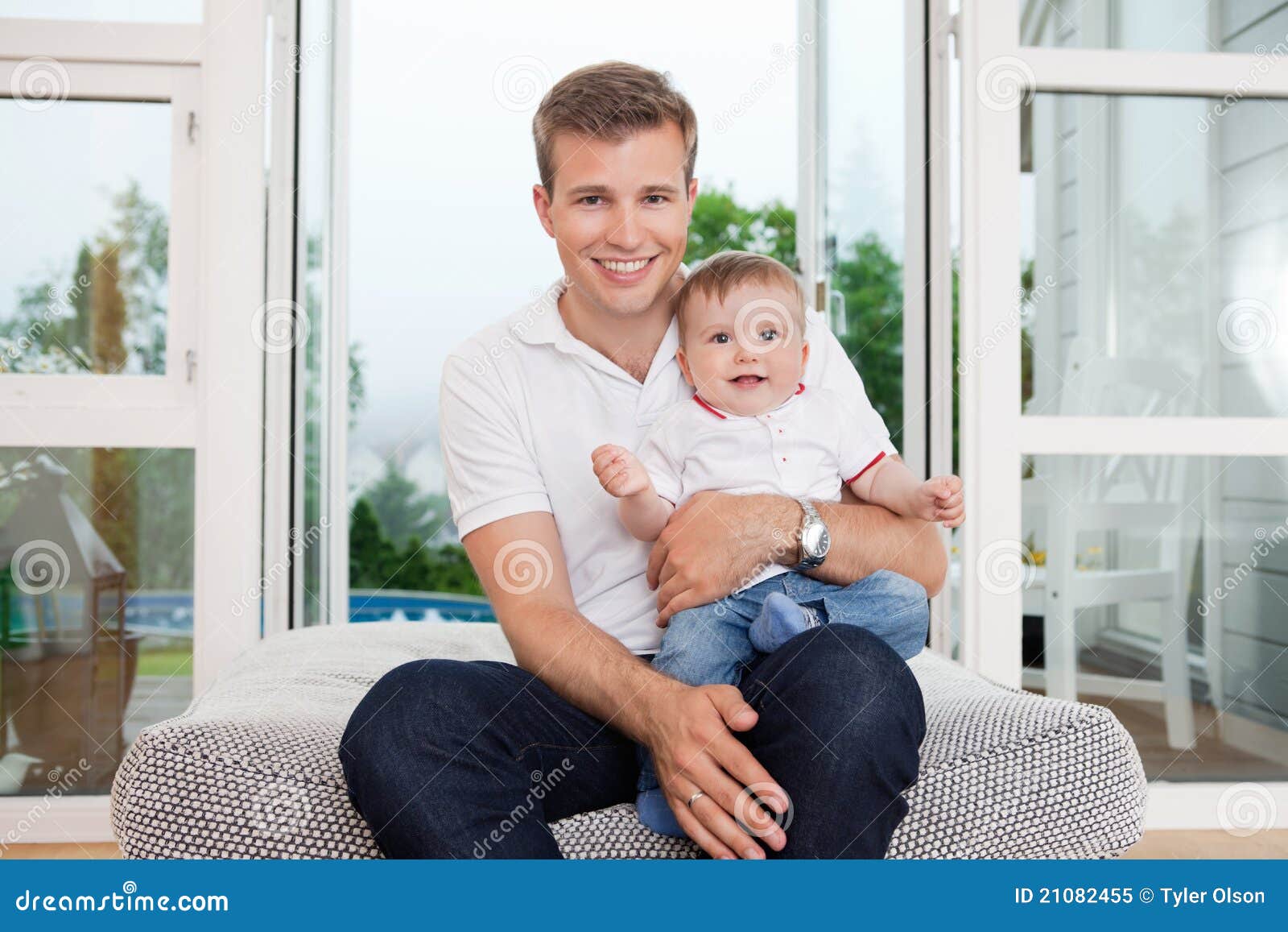 Father and child on couch stock image. Image of modern - 21082455