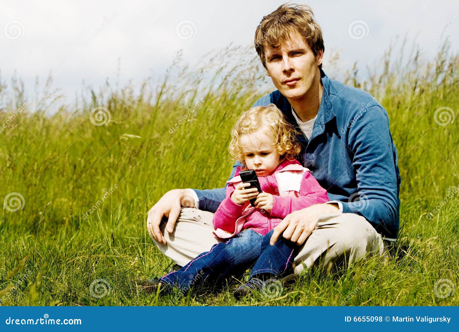 Father and Child Exploring Mobile Phone Stock Photo - Image of green ...