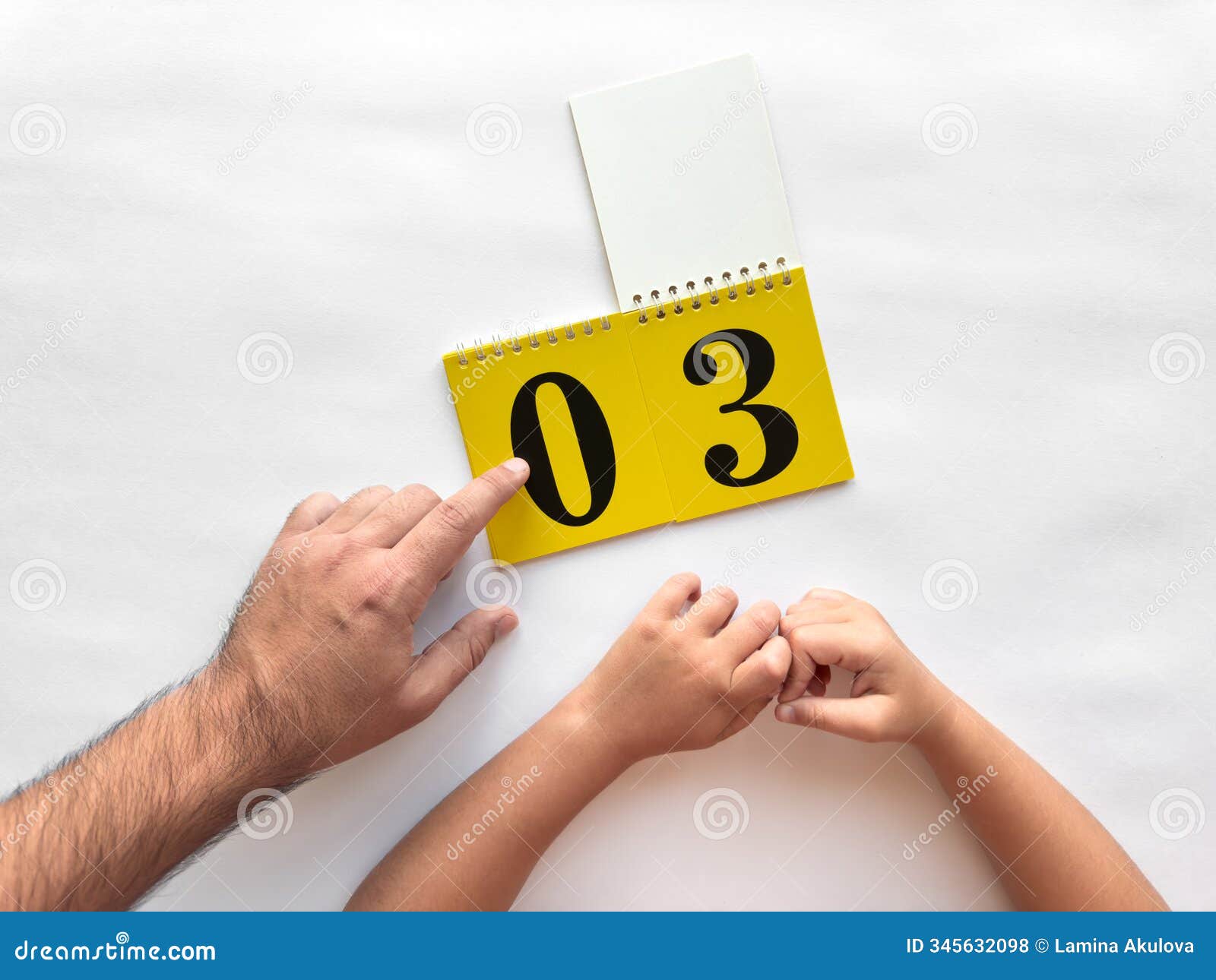 Father and Child Learning Numbers with a Yellow Flip Calendar Stock ...