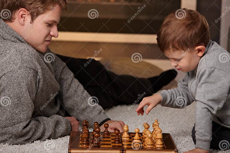 Father and Child Playing Chess Stock Photo - Image of family, chess ...