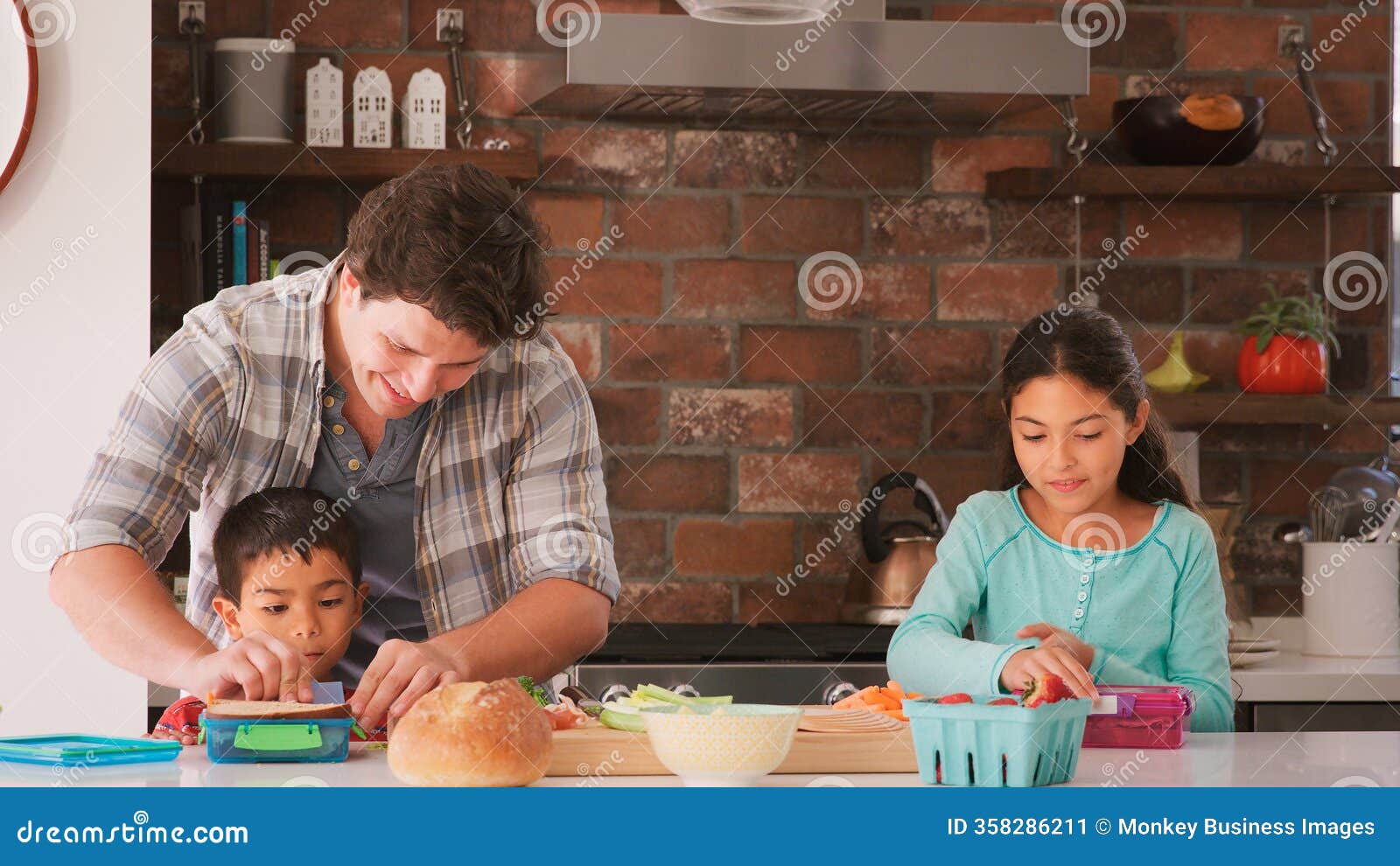 Father and Children Making Sandwiches for School Packed Lunch in ...