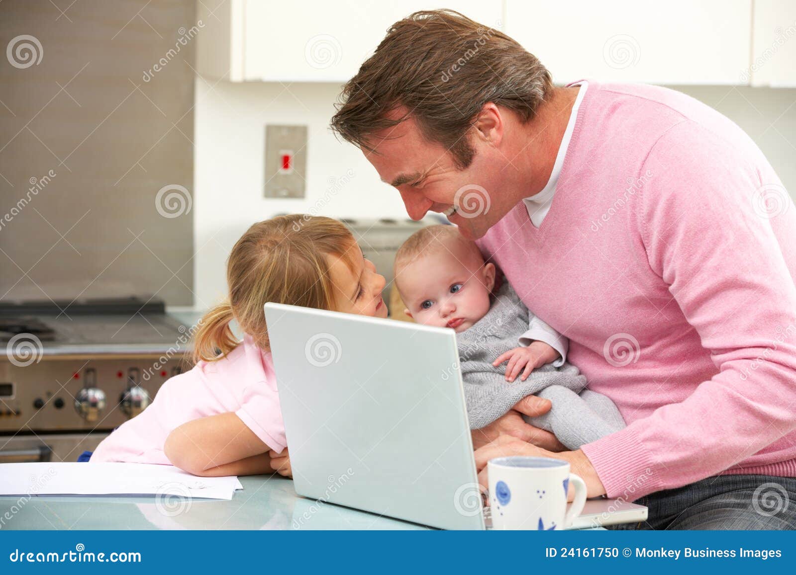 Father with Children Using Laptop in Kitchen Stock Photo - Image of ...