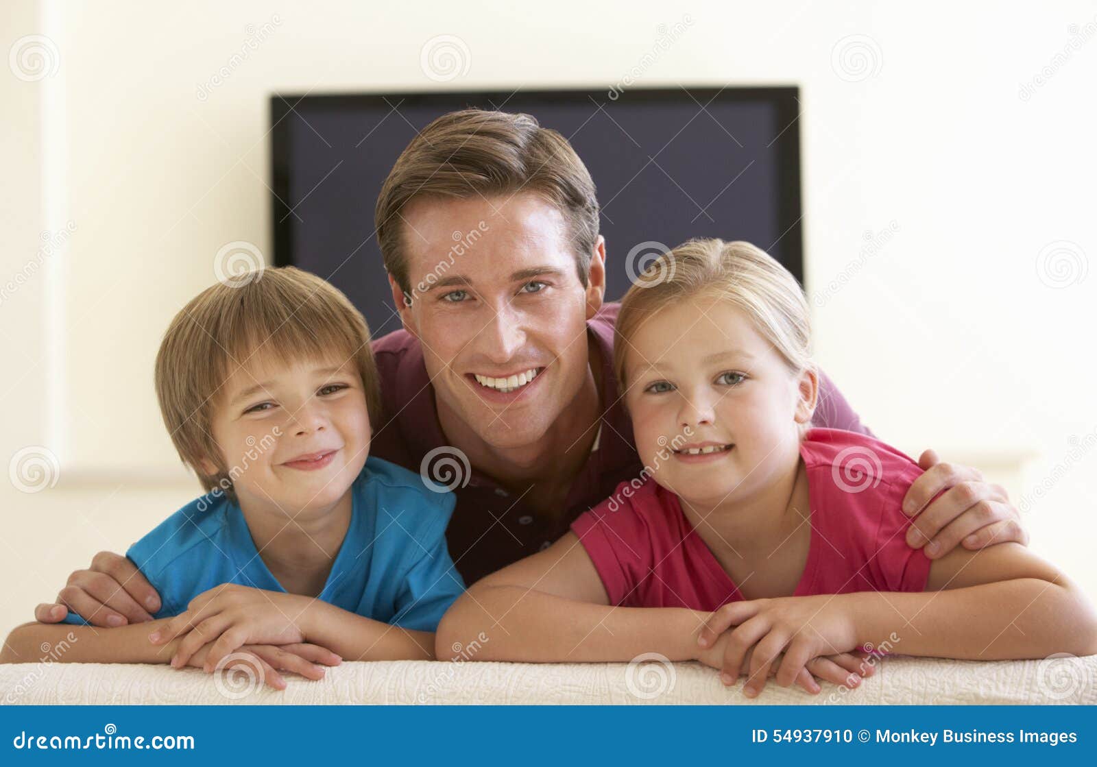 Father and Children Watching Widescreen TV at Home Stock Photo - Image ...